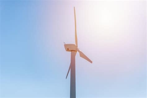 Premium Photo One Wind Power Turbine And Sunblue Skywind Power