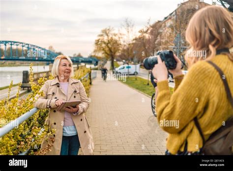 Photographer With New Camera Take Photo 50s Mom Models With Digital