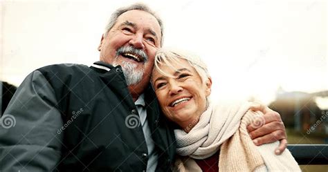 Retirement Hug And Senior Couple On Bench At Park With Happiness Or