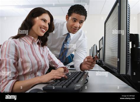 Man And Woman Using Computer Together Stock Photo Alamy