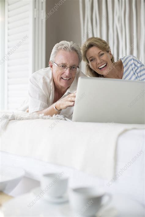 Older Couple Using Laptop On Bed Stock Image F0141944 Science