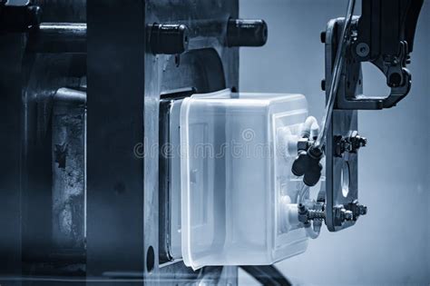 Close Up Scene Material Handling Process The Food Container By Robotic System From Injection