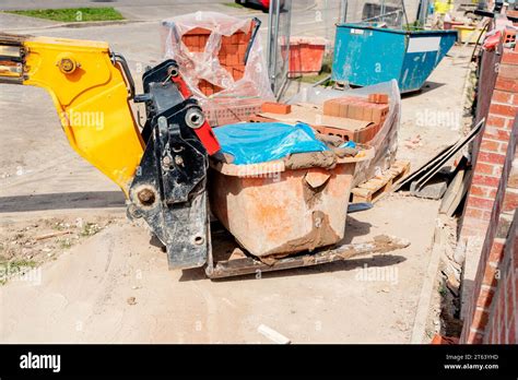 Forklift Bringing Tube Of Mortar For Bricklayers Stock Photo Alamy