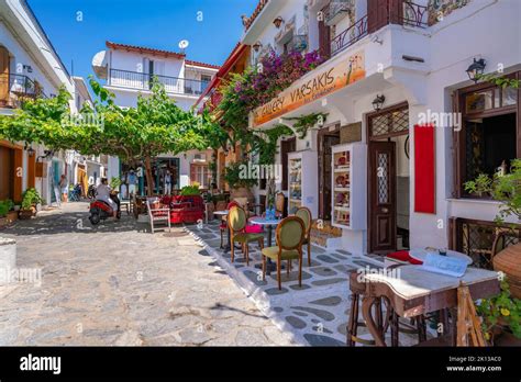 View Of Tavernas In Whitewashed Street In Skiathos Town Skiathos