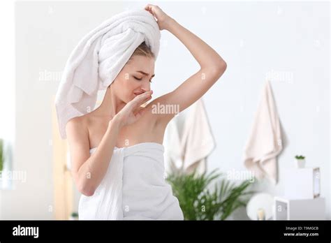 Beautiful Young Woman After Shower Feeling Smell Of Sweat Concept Of