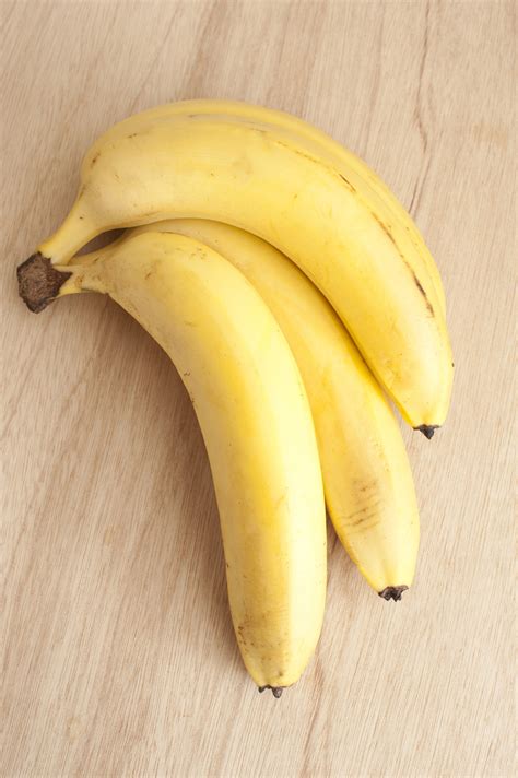 Bunch Of Bananas On Wooden Table Stockarch Free Stock Photos
