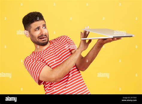 Scared Frightened Man With Beard Showing Stop To Laptop Screen With Video Call Looking