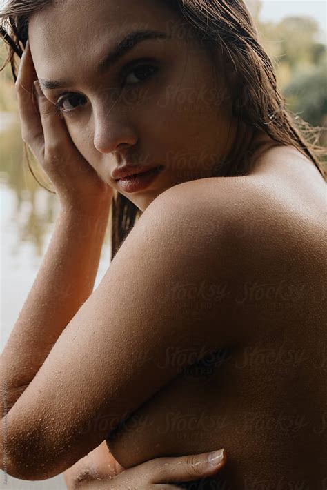 Portrait Of Naked Woman With Big Eyes And Brown Hair In Water Del