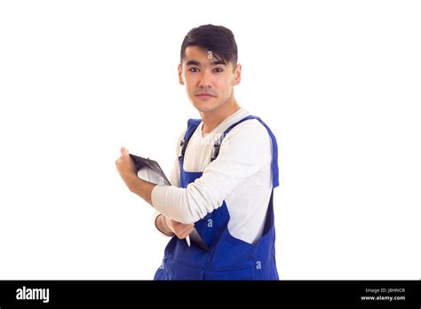 Young Handsome Man With Black Hair Wearing In White Shirt And Blue