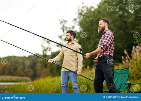 Friends With Fishing Rods At Lake Or River Stock Image Image Of