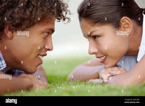 Shot Of A Happy Young Couple Gazing Into Each Others Eyes On The Lawn