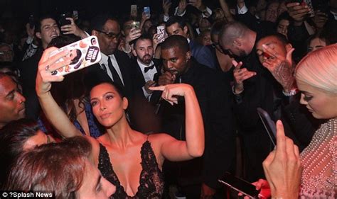 Kim Kardashian Wears A See Through Black Lace Dress At Harpers Bazaar