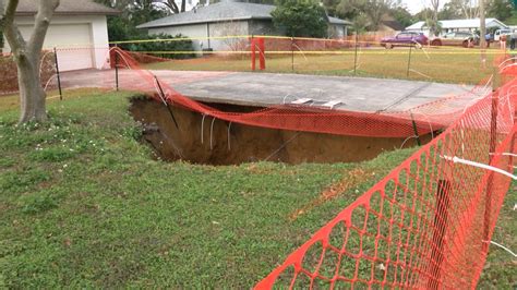 Crews Begin To Fill 60 Foot Deep Sinkhole In Polk County Wfla
