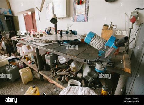 Messy Car Garage With Various Tools Stock Photo Alamy