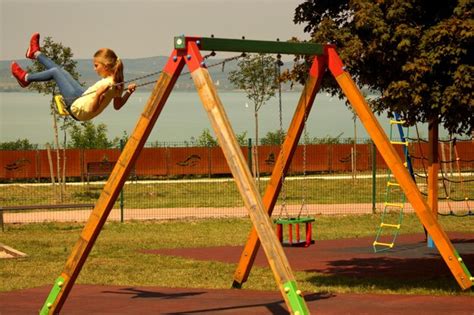 Premium Photo Girl Swinging In Park