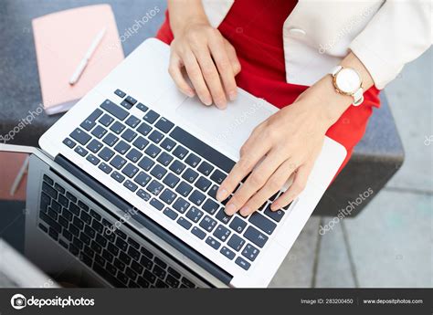 view closeup unrecognizable businesswoman typing laptop keyboard while