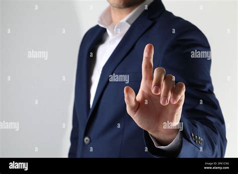 Man Scanning Fingerprint On Light Grey Background Closeup Stock Photo Alamy
