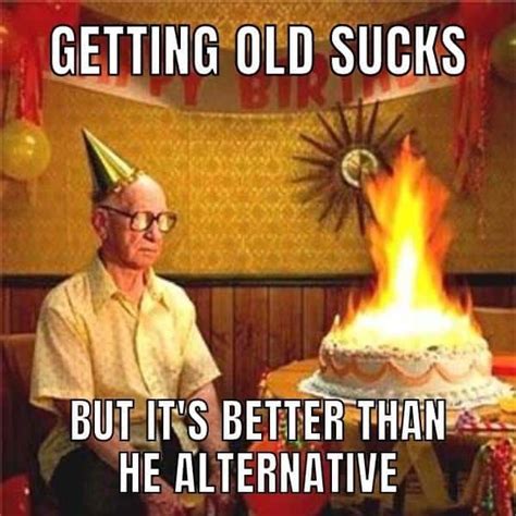 An Old Man Sitting In Front Of A Birthday Cake With The Words Happy