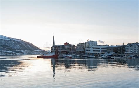 Boats And Ships Docked In One Of Tromso City Harbor In Winter Editorial