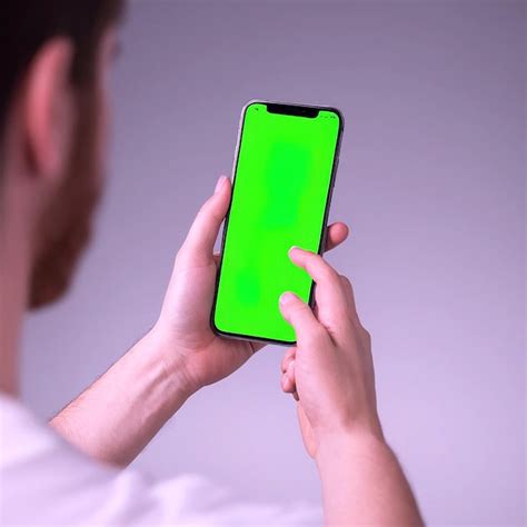 Man Holding Mobile Phone With Green Screen Premium Ai Generated Image