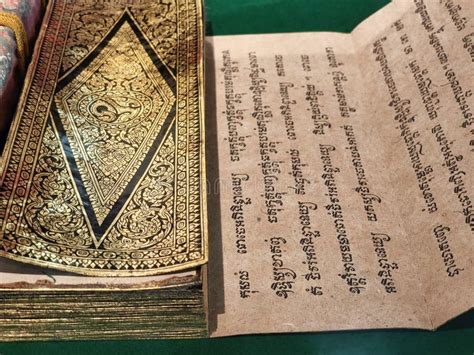 Ancient Thai Buddhist Scripture With Gold Leaf Cover And Traditional