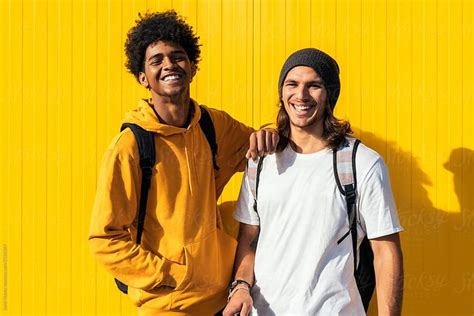 Teenager Friends Laughing Looking At Camera By Stocksy Contributor