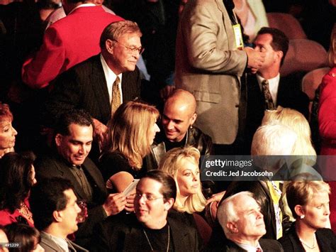 Andre Agassi Escorts Steffi Graf Into The Arena Before The Start Of