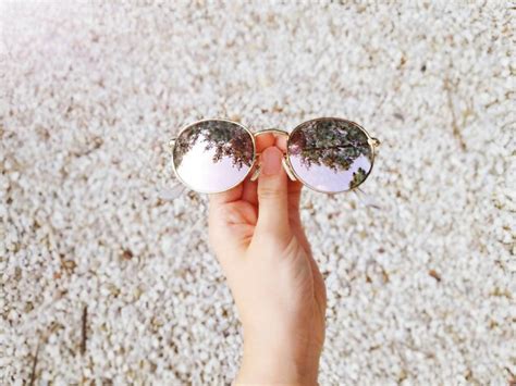 Premium Photo Close Up Of Hand Holding Sunglasses