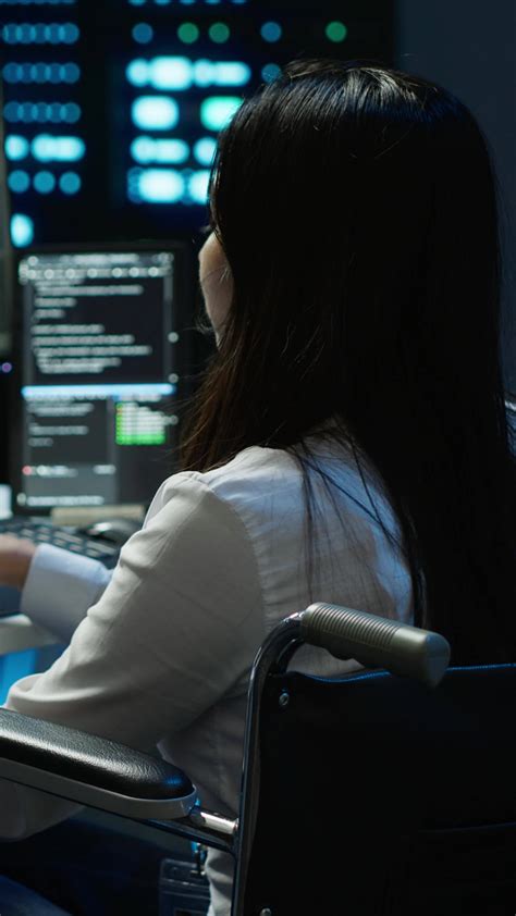 Vertical Person With Paraplegia In Inclusive Server Hub Overseeing Data Center Making