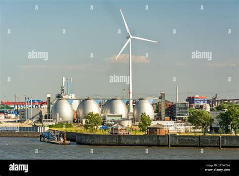 Gas Storage Reservoir And Large Wind Turbine In The Harbour Area In
