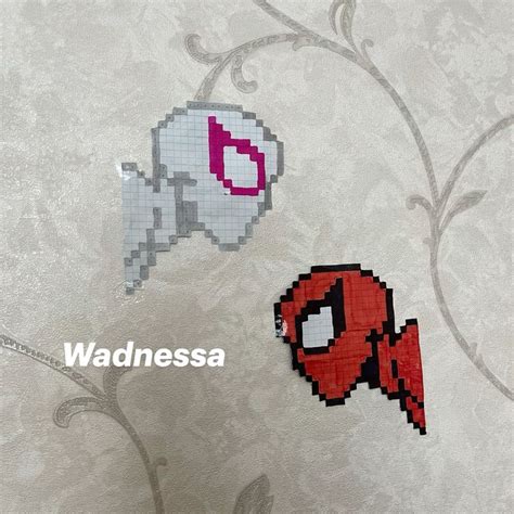 Рисунок по клеткам человека паука и его девушка