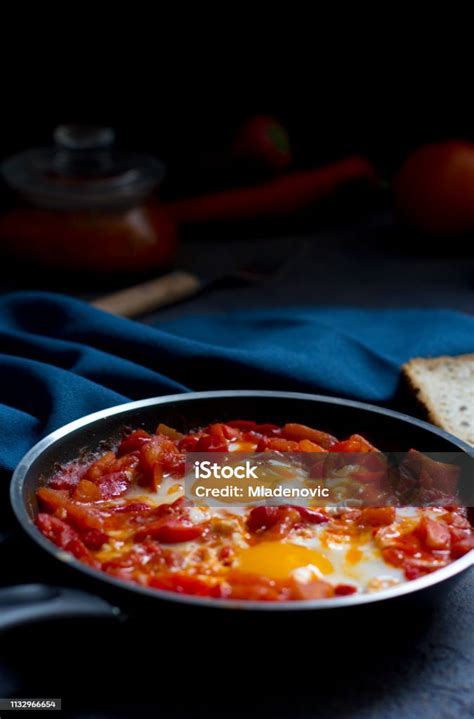 Shakshouka Or Shakshuka Eggs In A Sauce Of Tomatoes And Peppers Dark