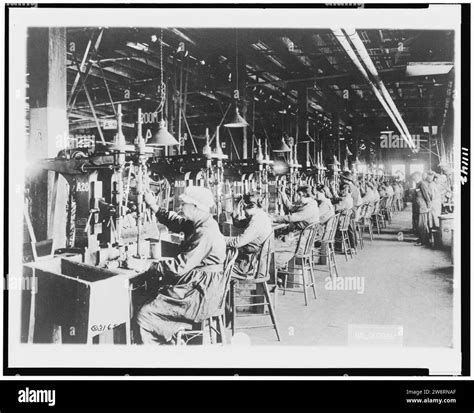 Women Operating Drill Presses For Reaming Out Holes In Hand Grenade