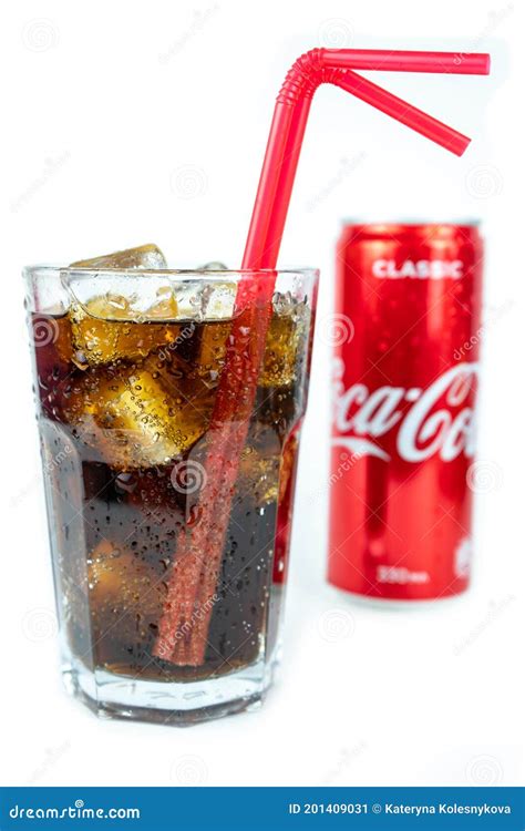 Glass Of Cold Refreshing Coca Cola Soda With Ice Metal Can Of Coca