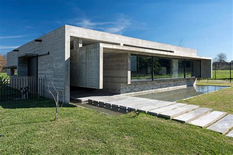 Reflecting Pool Fronts Linear Concrete House In Argentina By Luciano Kruk