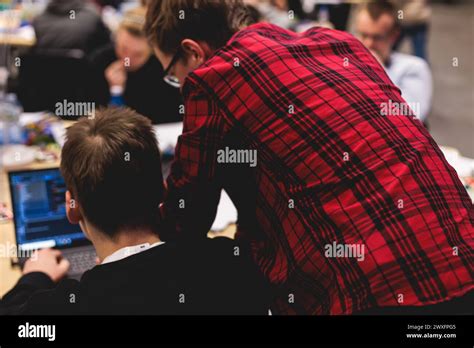 Software Developer Students In Auditorium Hall Working On Computer And