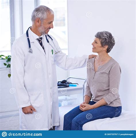 He Has A Great Bedside Manner A Doctor Reassuring A Patient Stock