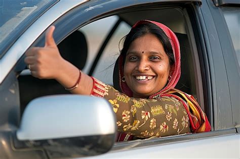 Premium Photo Indian Woman Shows Thumb Up In New Car