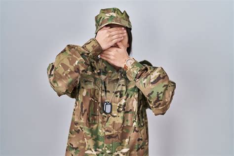 Young South Asian Woman Wearing Camouflage Army Uniform Covering Eyes
