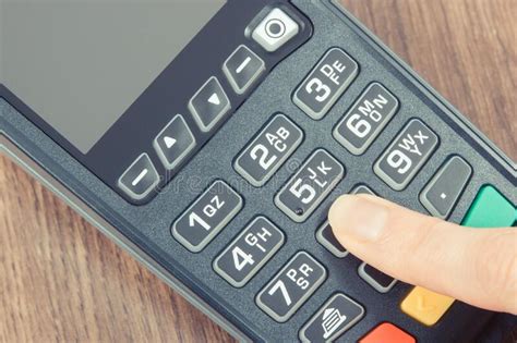 Hand Of Woman Entering Pin Code On Payment Terminal Cashless Paying For Shopping Finance