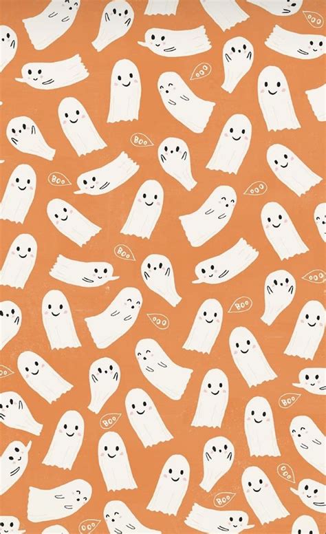 An Orange Background With White Ghost Faces On It