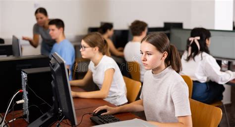 Smart Female Teenager Learning Computer Science While She Is Using A Pc