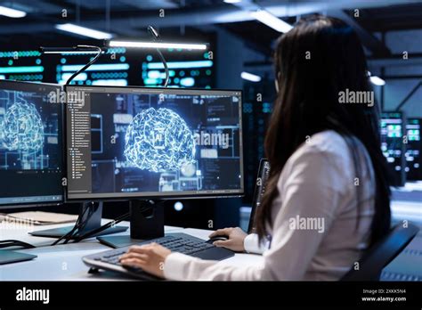 Engineer Working In Data Center Providing Computing Resources Needed For Artificial Intelligence