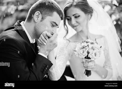 Groom Kiss Hand Bride Stock Photo Alamy