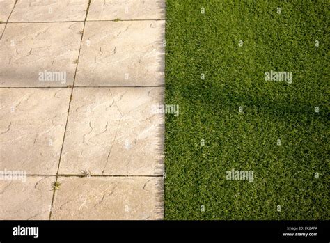 Artificial Grass Astro Turf Meets Paving Slabs On A New Build Housing