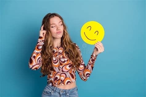 Photo Of Nice Young Girl Scratch Head Hold Emoji Wear Top Isolated On