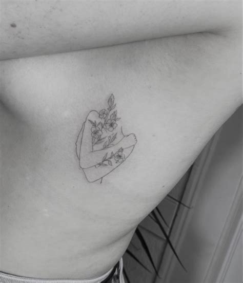 Fine Line Flower Head Woman Tattoo On The Rib Artofit