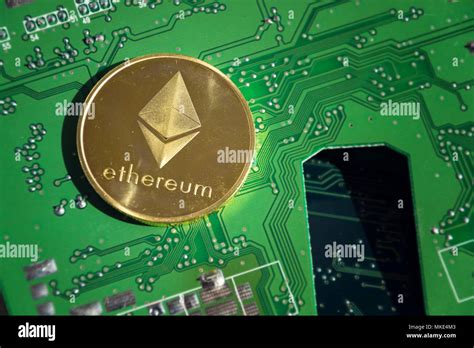 Golden Ethereum Coin Lying On Computer Motherboard Cryptocurrency