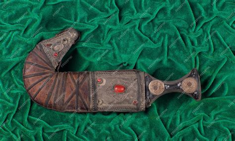 Premium Photo Arabic Dagger On Green Velvet