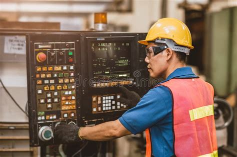 Asian Worker Work With Automated Digital Lathe Cnc Metal Machine